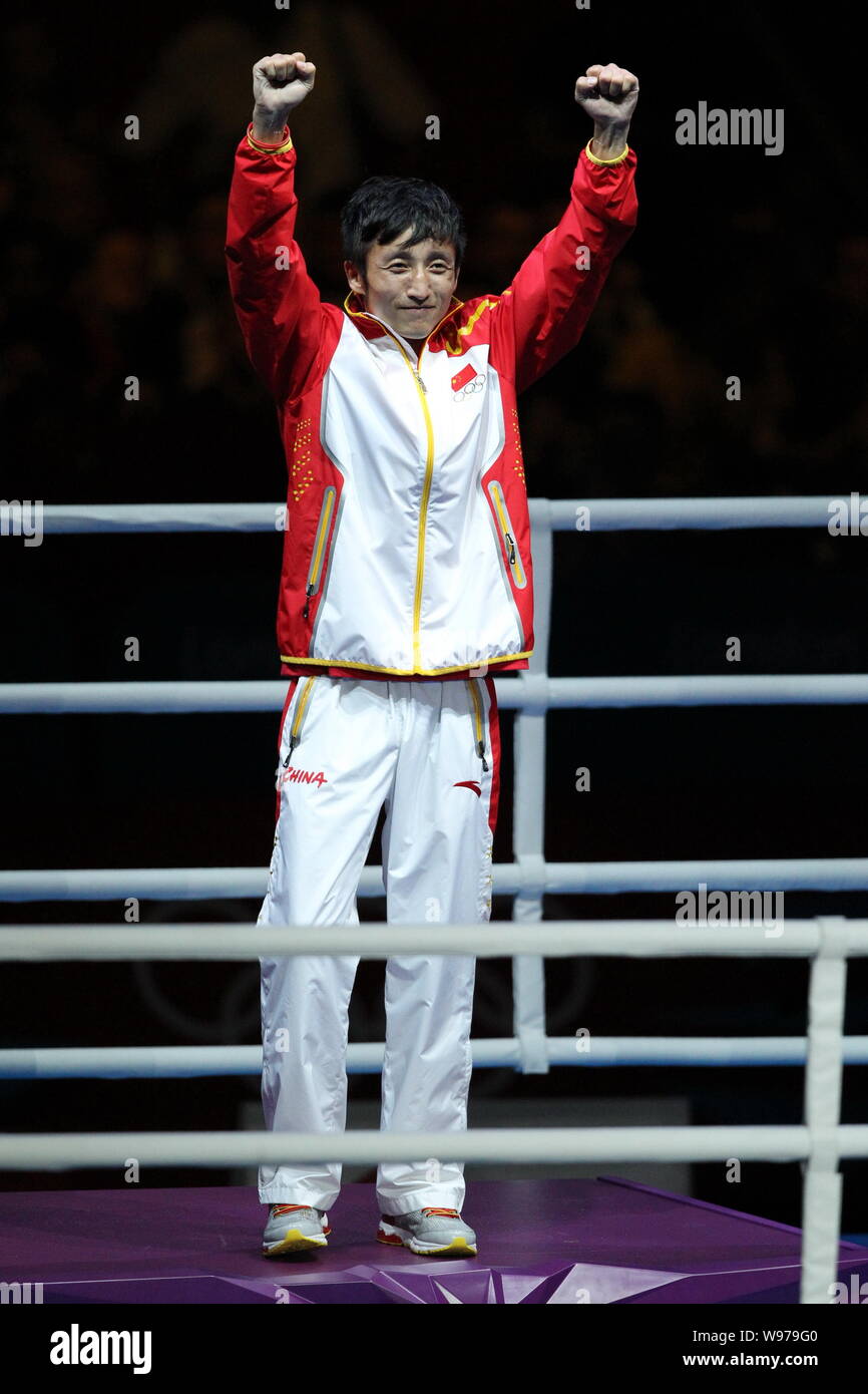 Gold medalist Zou Shiming of China celebrates in the award ceremony of ...