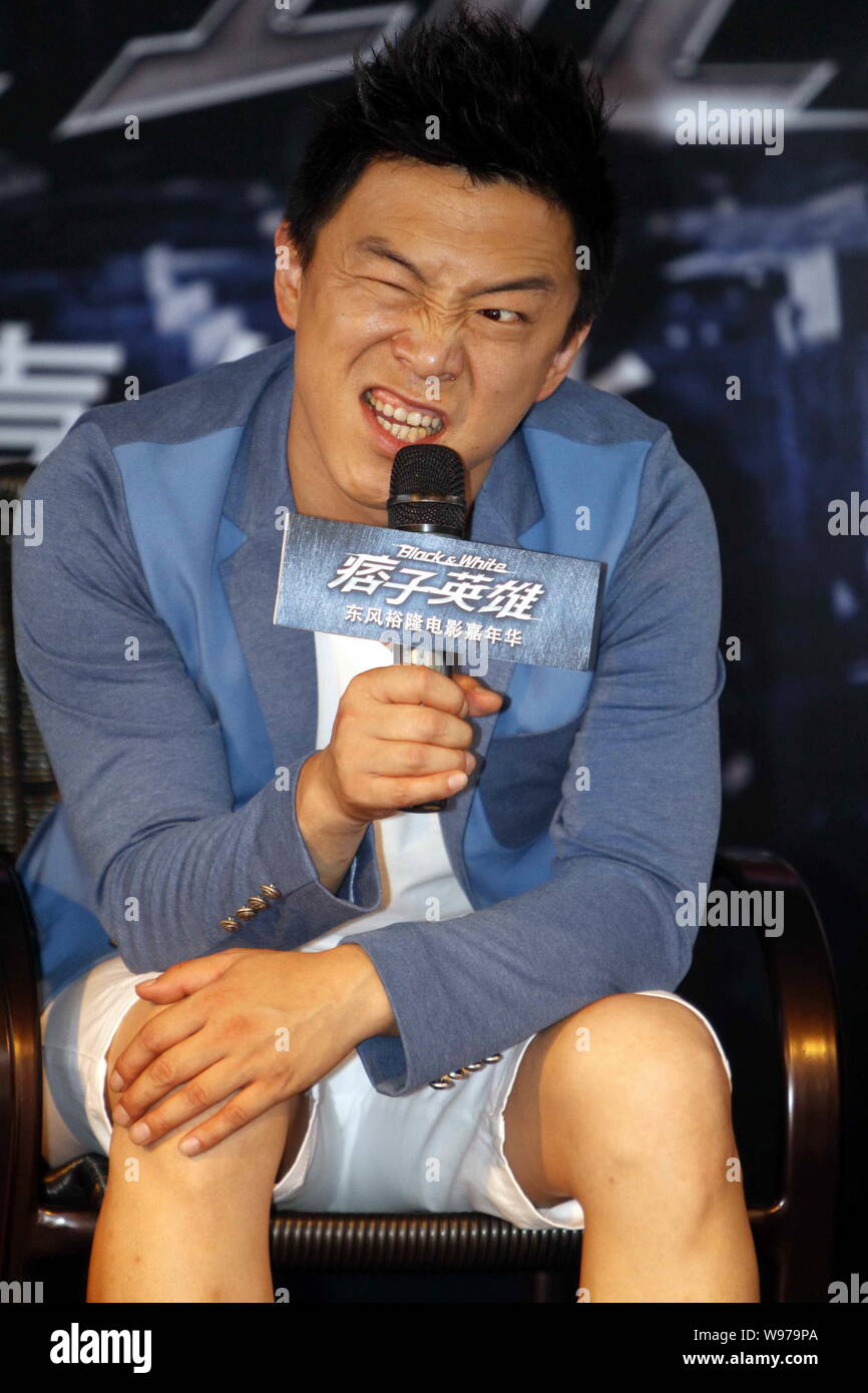 Chinese actor Huang Bo makes a funny face during the premiere carnival ...