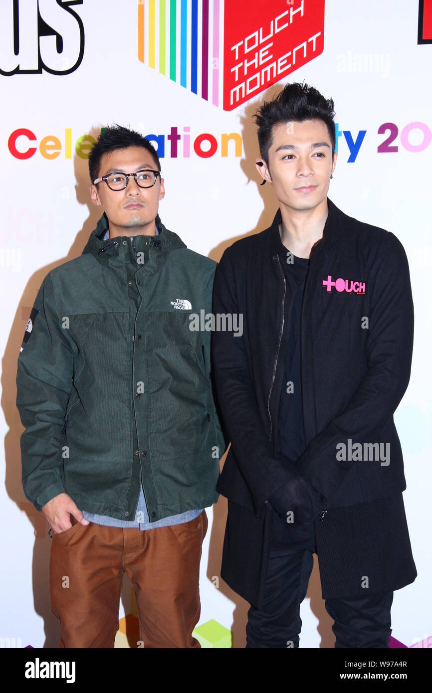 Hong Kong celebrities Shawn Yu (left) and Chau Pak Ho (right) poes at a ...