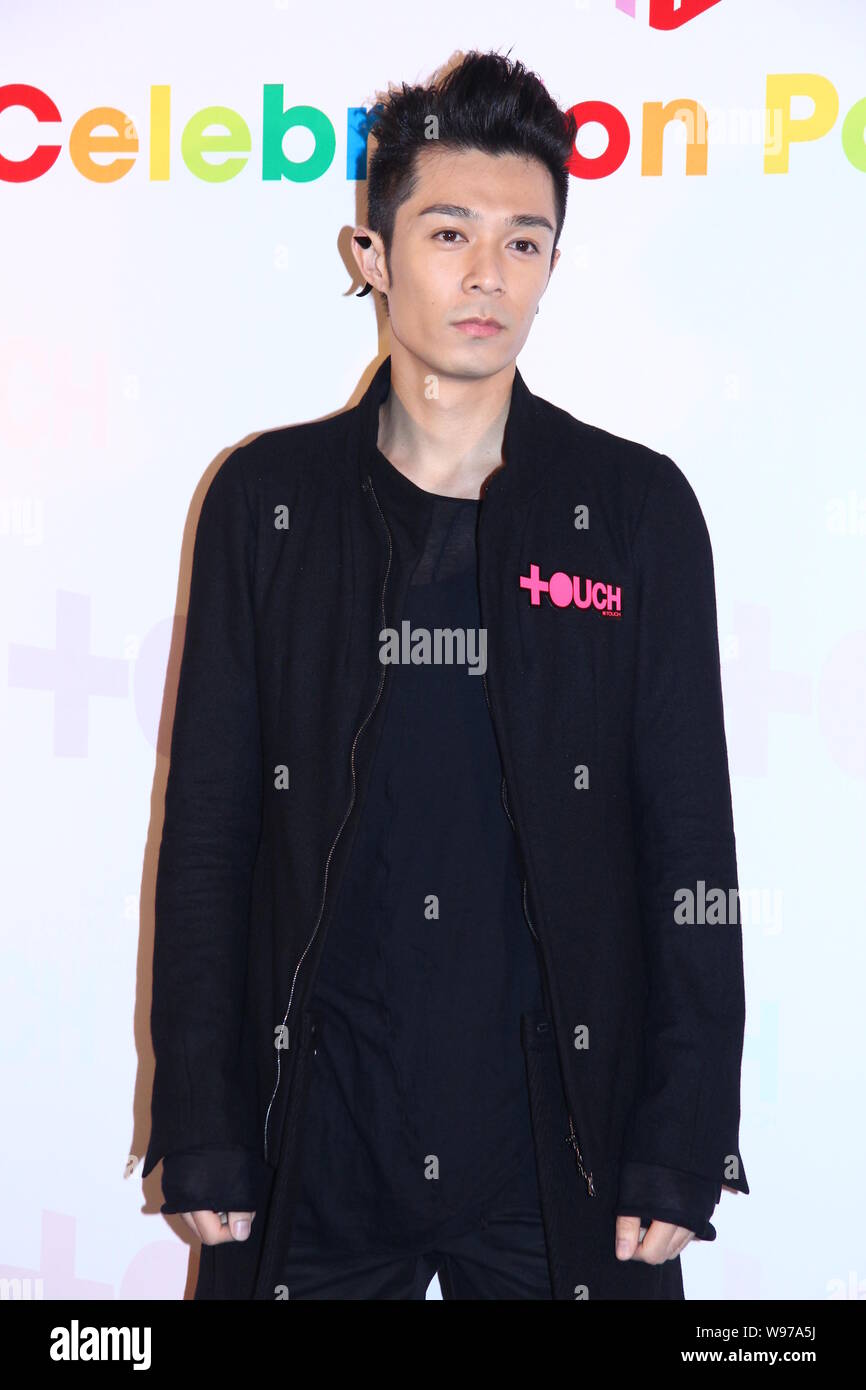 Hong Kong singer and actor Chau Pak Ho poses as he arrives for a ...