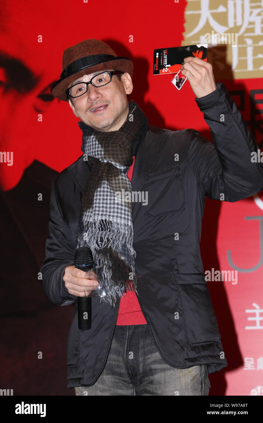 Hong Kong superstar Jacky Cheung shows the ticket of his concert during ...
