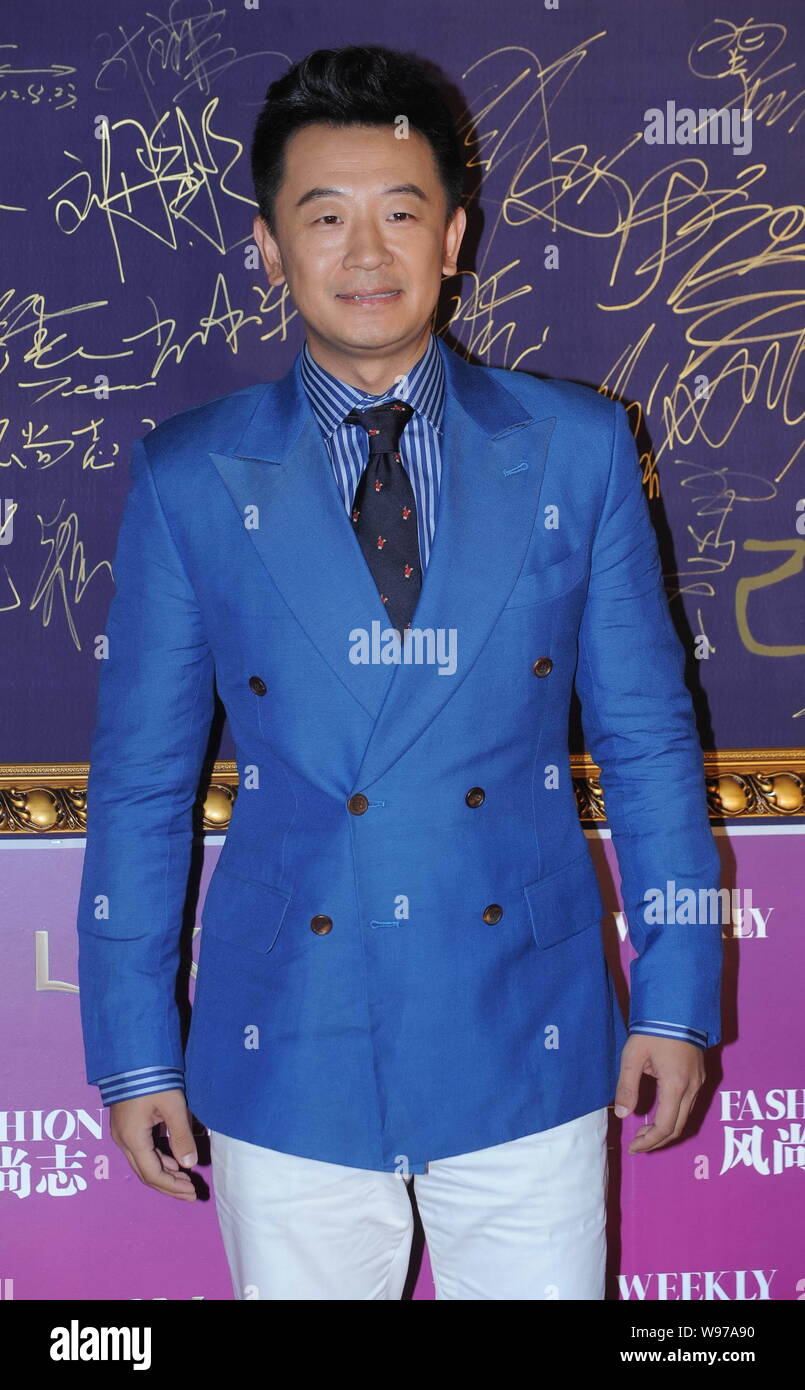 Chinese actor Huang Haibo poses on the red carpet during the Fashion ...