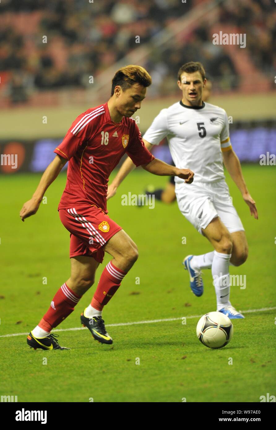 Gao Lin of China, left, prepares to shoot against New Zealand during a ...