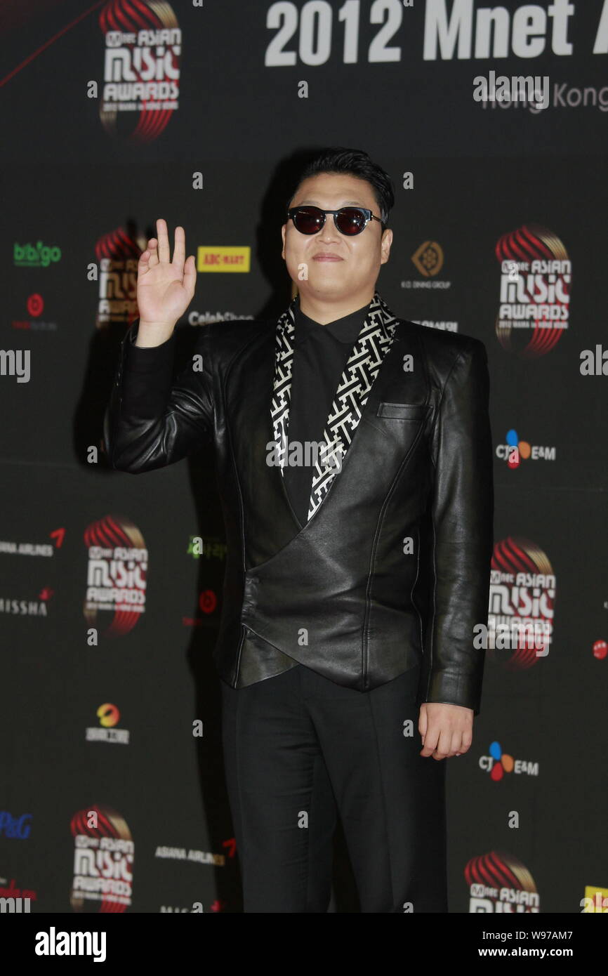 South Korean singer PSY (Park Jae-sang) waves on the red carpet as he ...