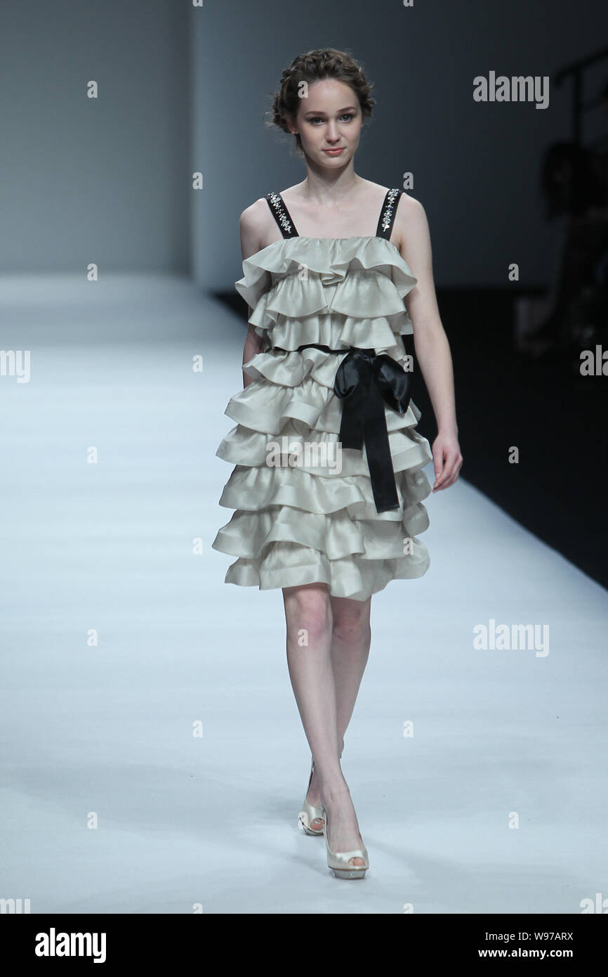 A model displays a new creation by Hong Kong fashion designer Dorian Ho ...