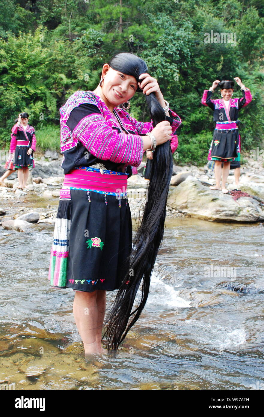 Women of Red Yao minority ethnic group wash their long hair in the ...