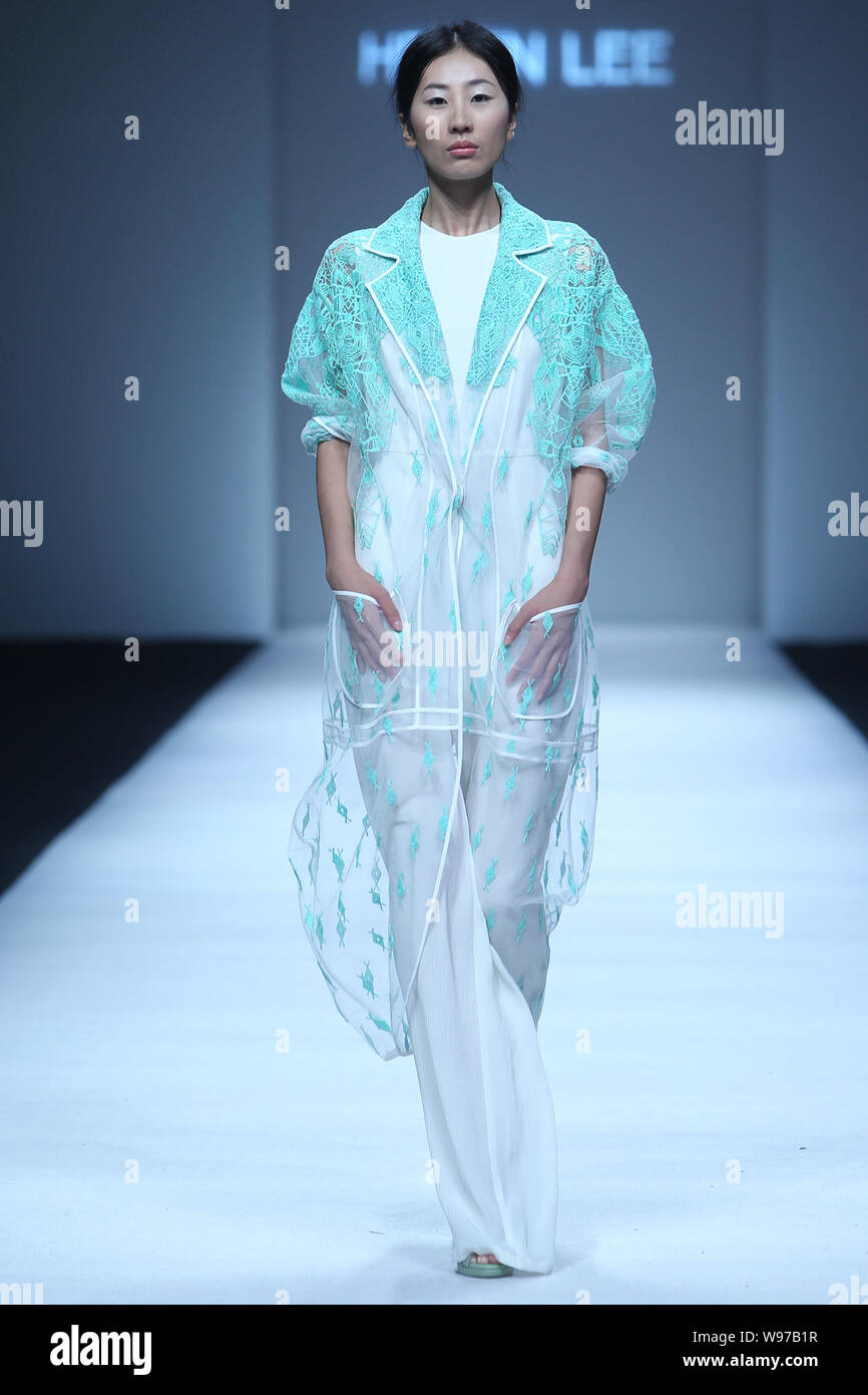 A model displays a new creation by Chinese fashion designer Helen Lee ...