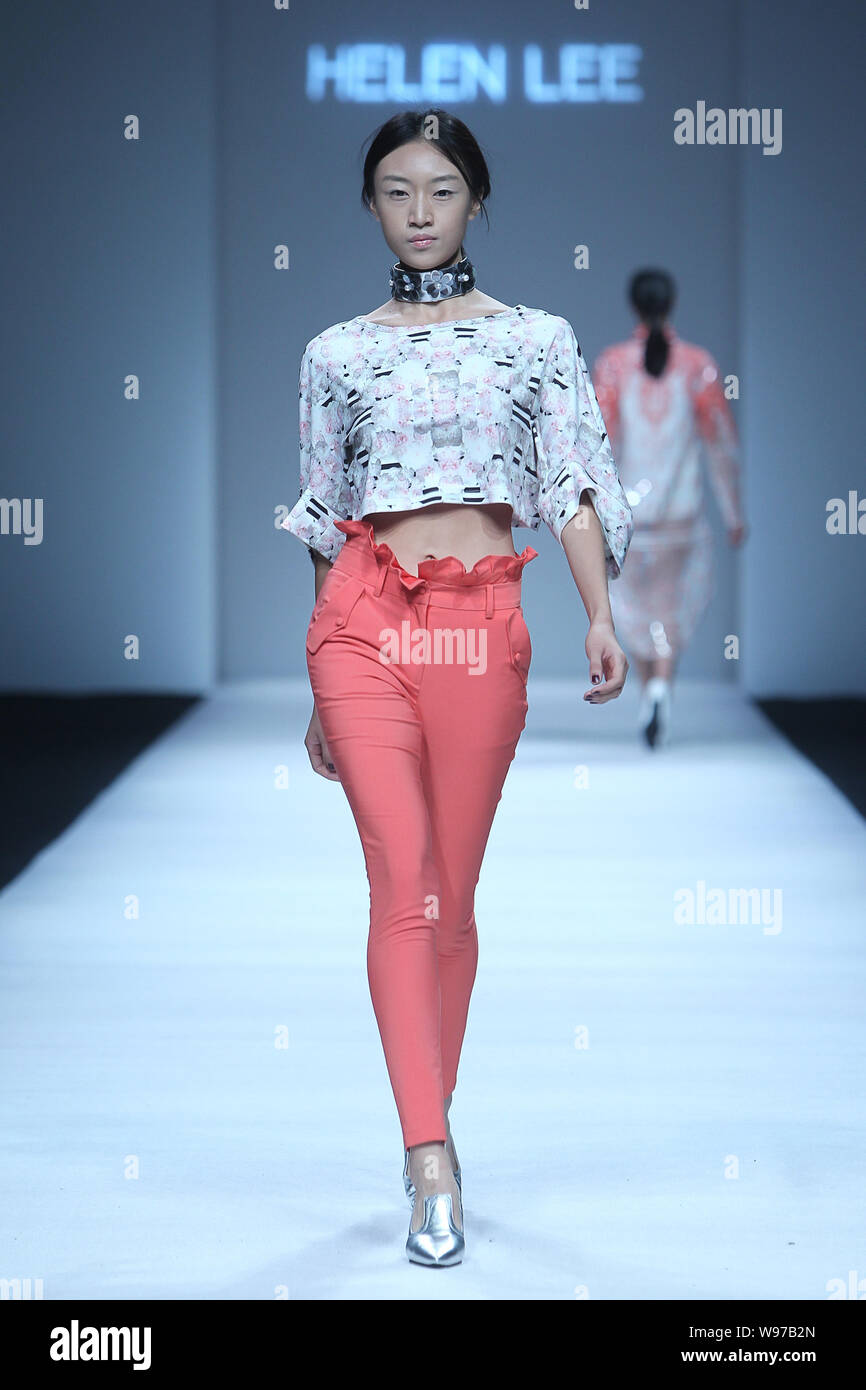 A model displays a new creation by Chinese fashion designer Helen Lee ...