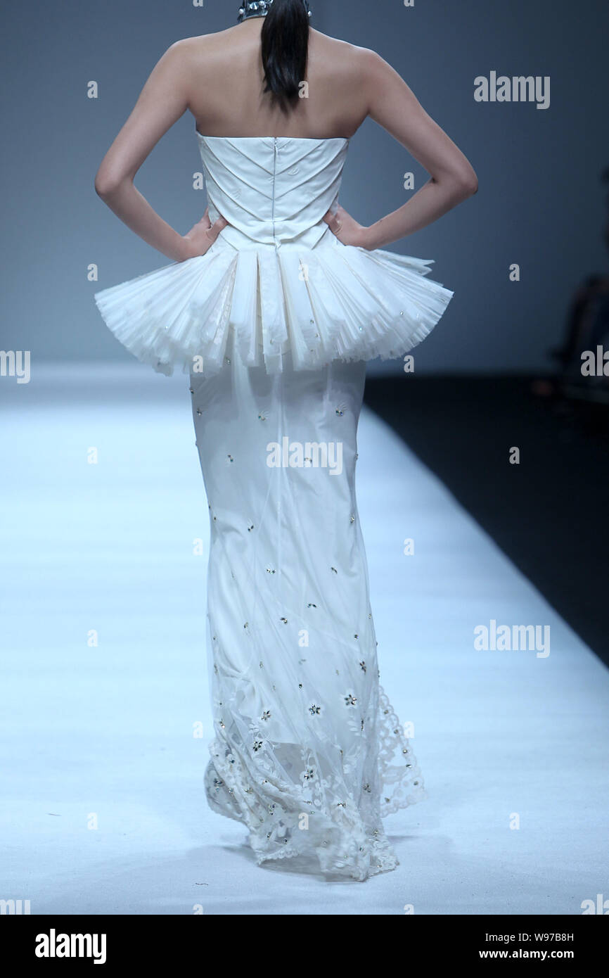 A model displays a new creation by Chinese fashion designer Helen Lee ...