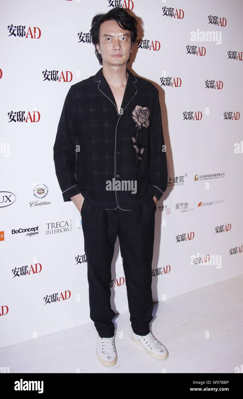 Chinese musician Li Quan poses during the fashion activity held by AD ...