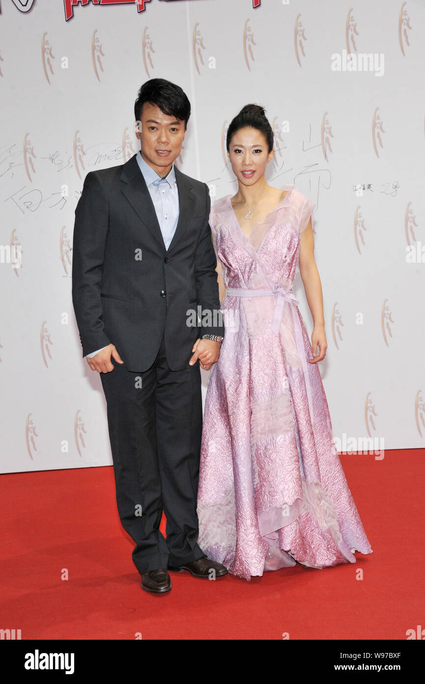 Chinese figure skating duo Shen Xue, right, and Zhao Hongbo pose on the ...