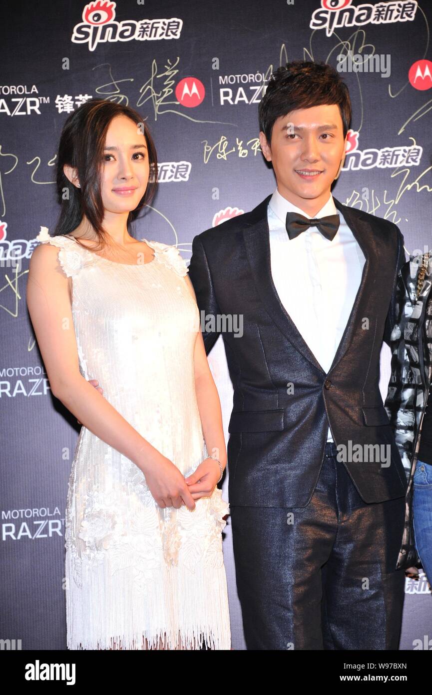 Chinese actress Yang Mi and actor William Feng pose during a ceremony ...
