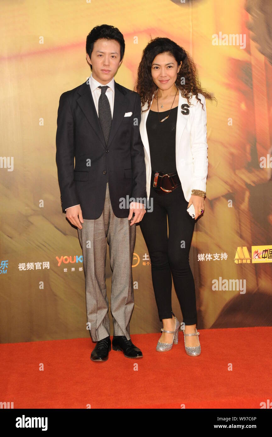 Chinese pianist Li Yundi, left, poses with Su Mang, Editor-in-chief and ...