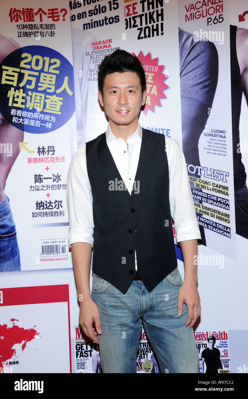 Chinese Olympic badminton champion Cai Yun poses on the red carpet as ...