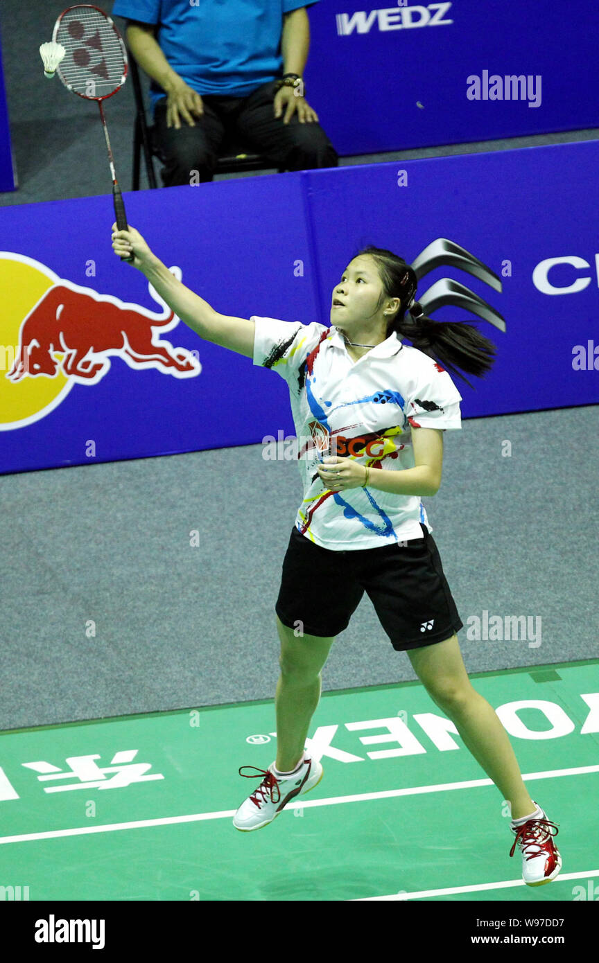 Inthanon Ratchanok of Thailand returns a shot against Wang Yihan of ...