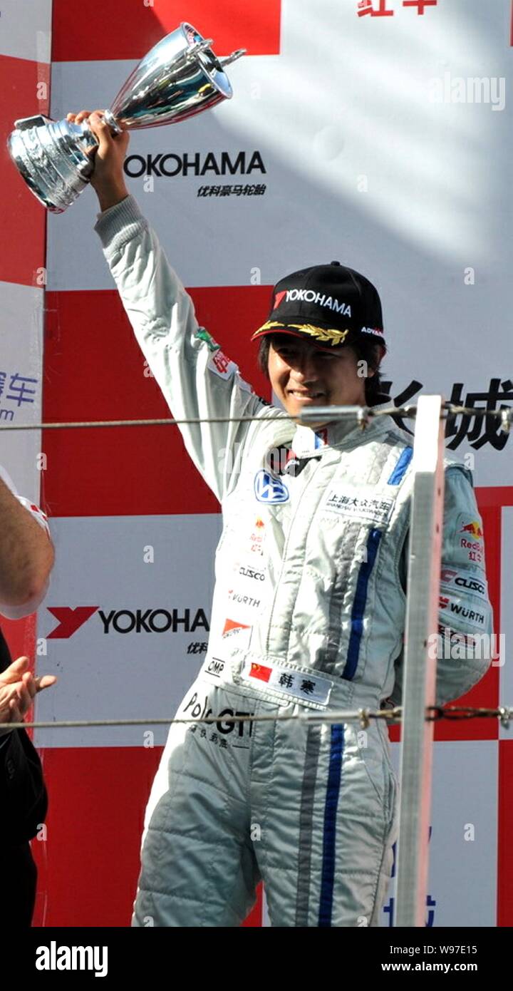 Han Han of Shanghai VW 333 Racing Team holds up his trophy to celebrate ...