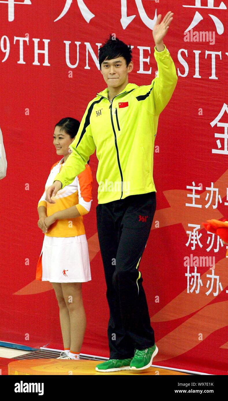 Gold medalist and Olympic swimming champion Sun Yang waves on the ...