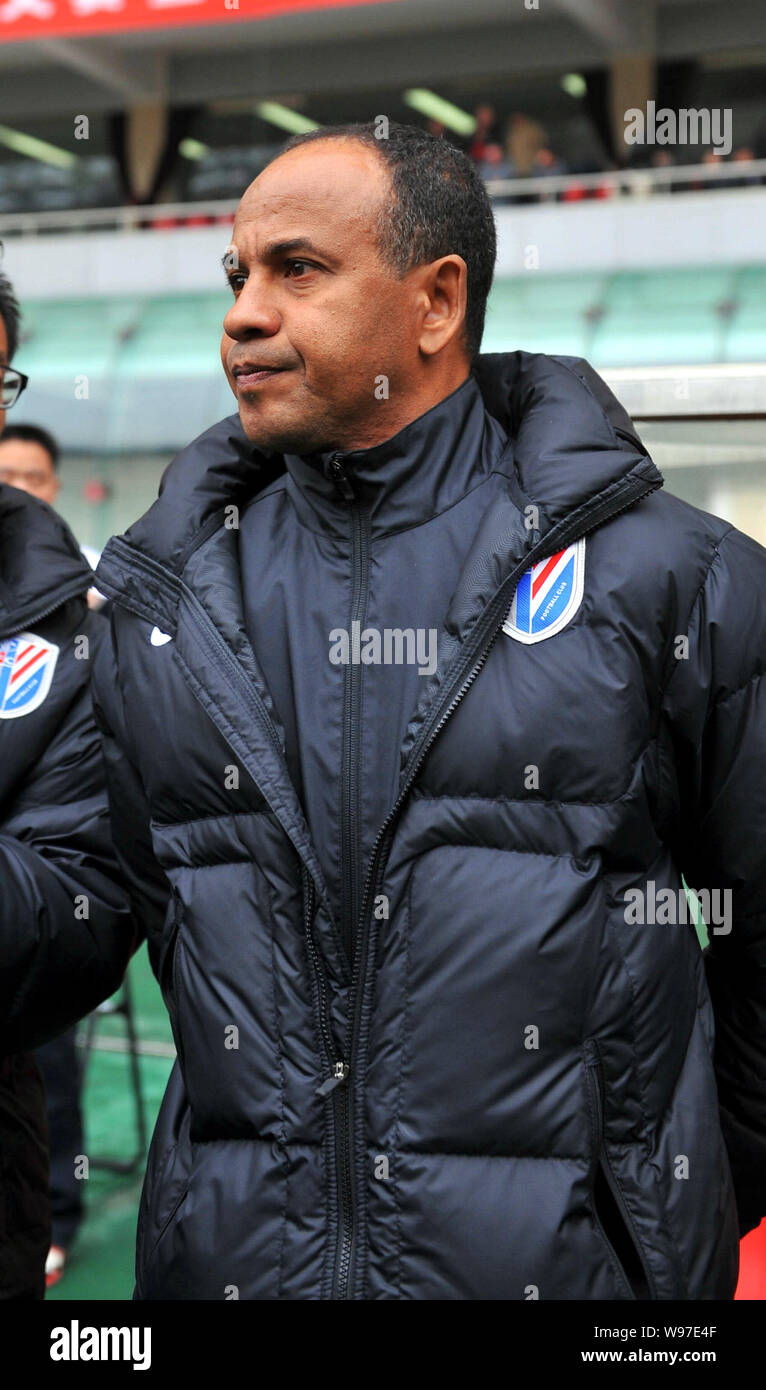 French head coach Jean Tigana of Shanghai Shenhua looks at his players ...