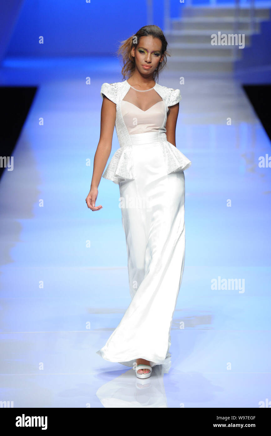 A model displays a new creation by Hong Kong designer Dorian Ho in the ...