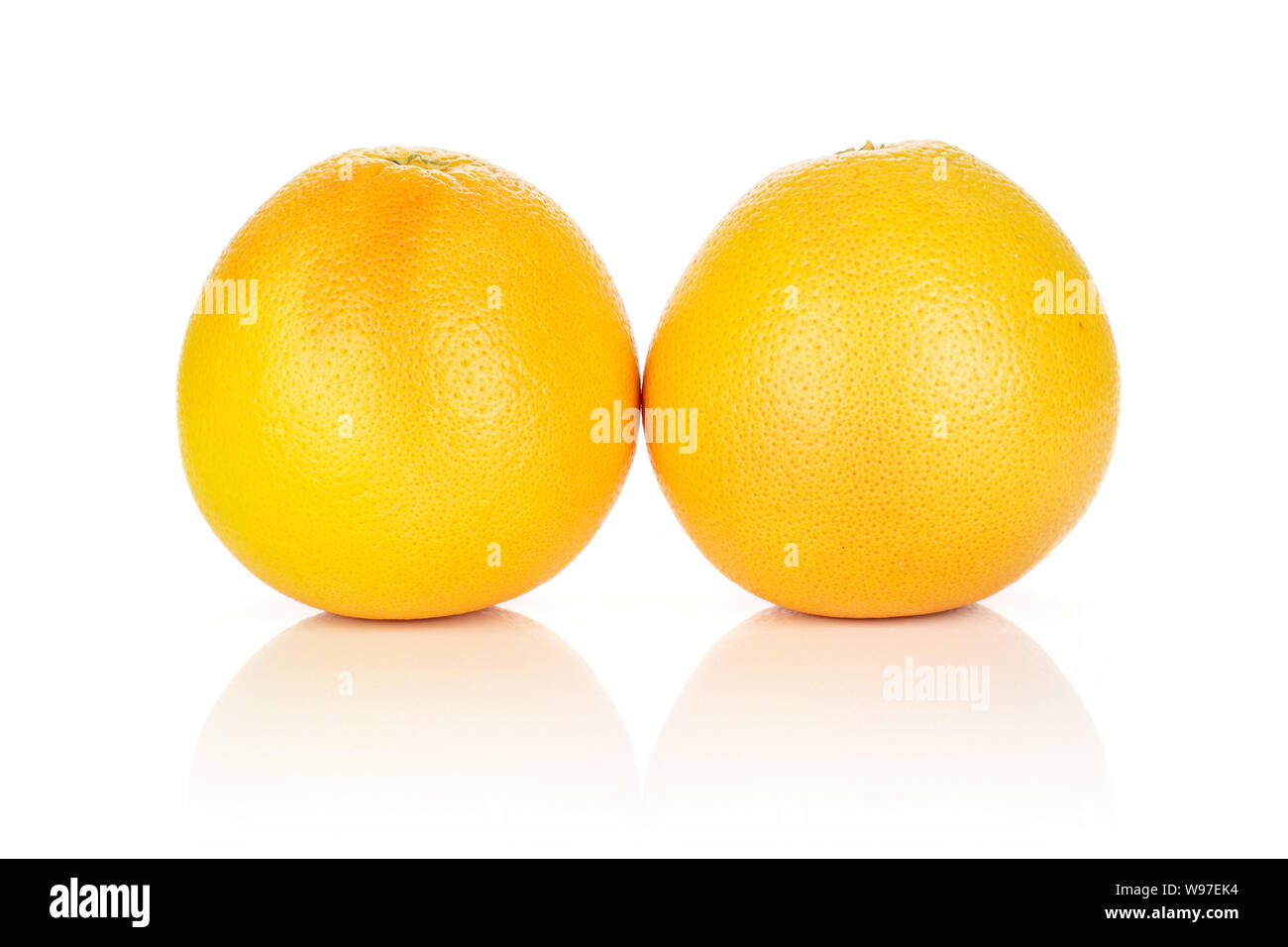 Group of two whole fresh pink grapefruit isolated on white background ...