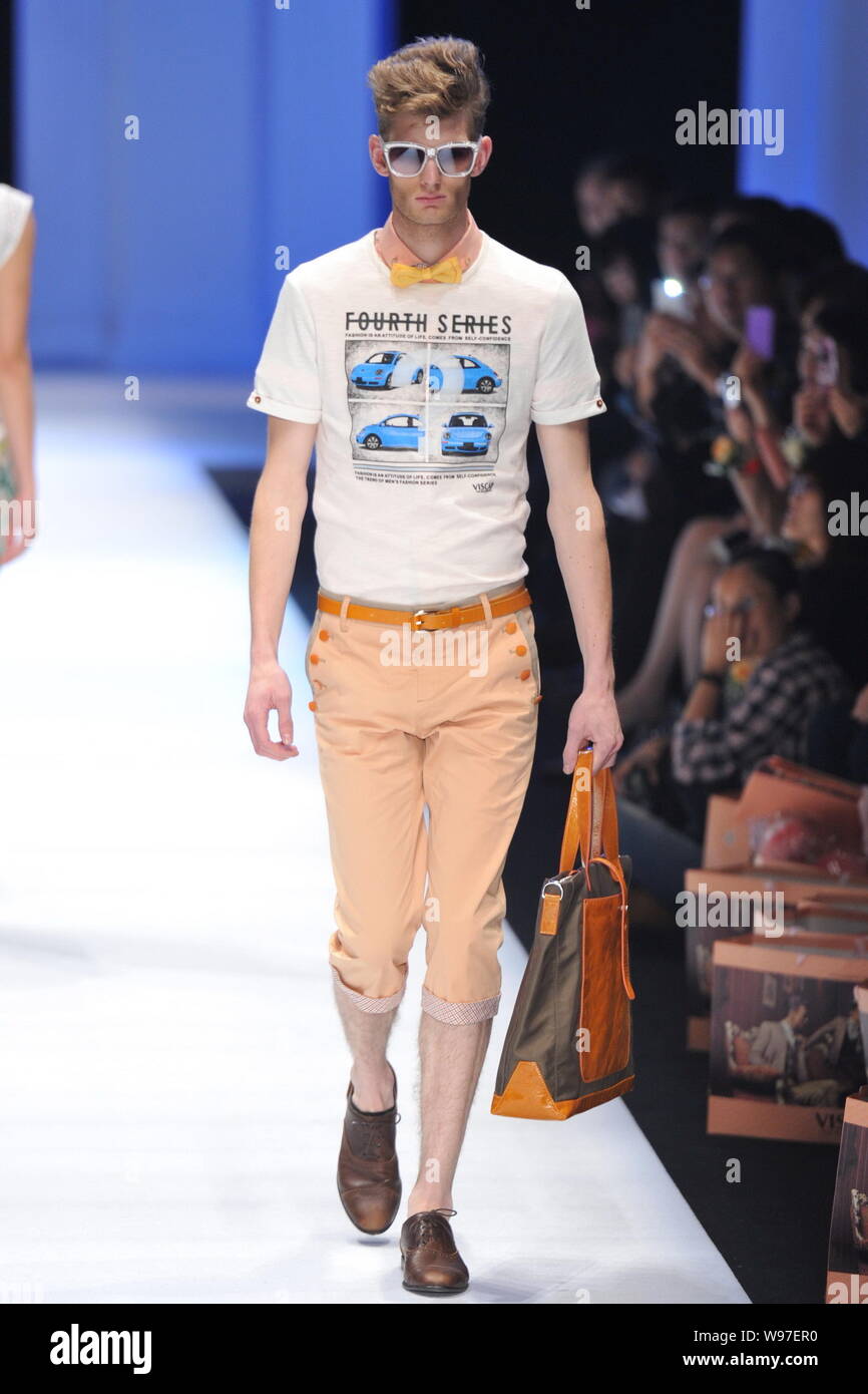 A model displays a new creation by Chinese designer Yuan Bing in the ...