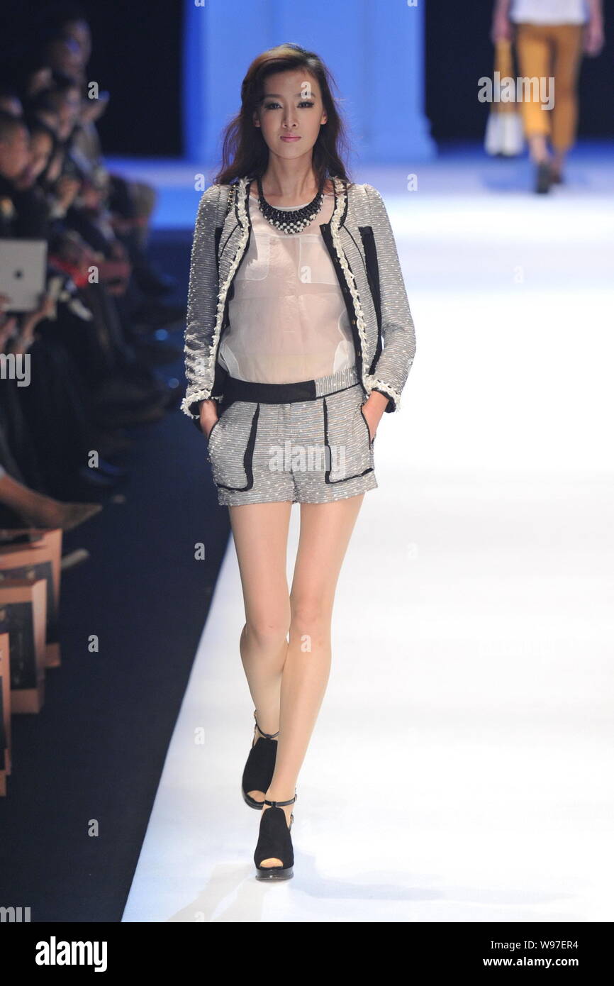 A model displays a new creation by Chinese designer Yuan Bing in the ...