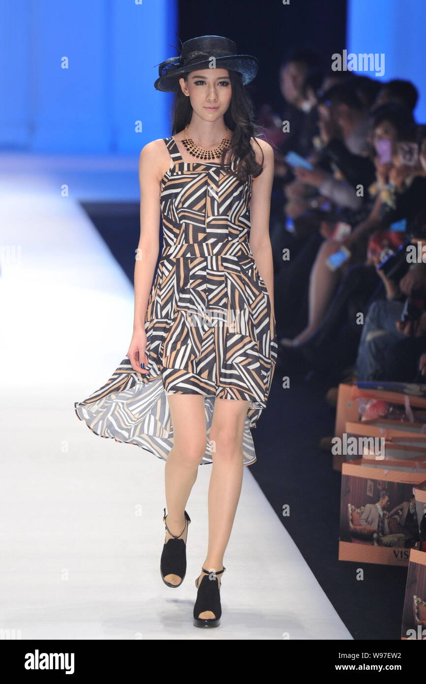 A model displays a new creation by Chinese designer Yuan Bing in the ...