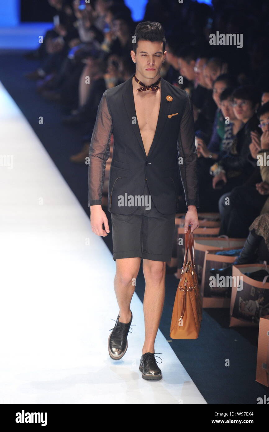 A model displays a new creation by Chinese designer Yuan Bing in the ...