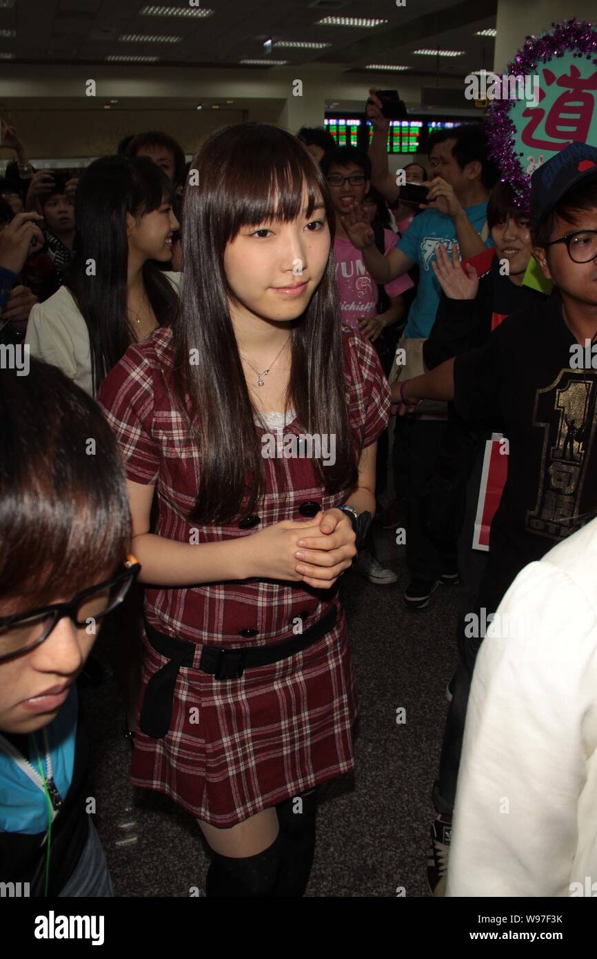 Members of Japanese pop idol girl group Morning Musume arrive at Taipei ...