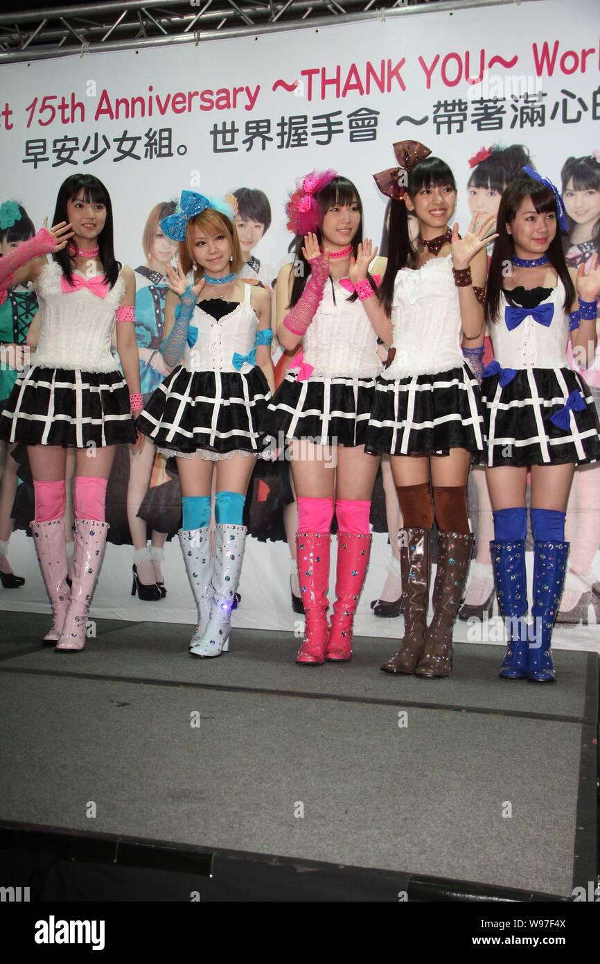 Members Of Japanese Pop Idol Girl Group Morning Musume Wave At A