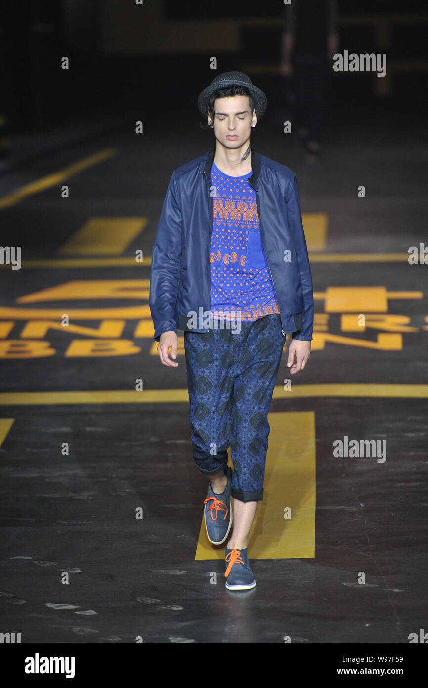 A model displays a new creation in the Cabbeen fashion show during the ...