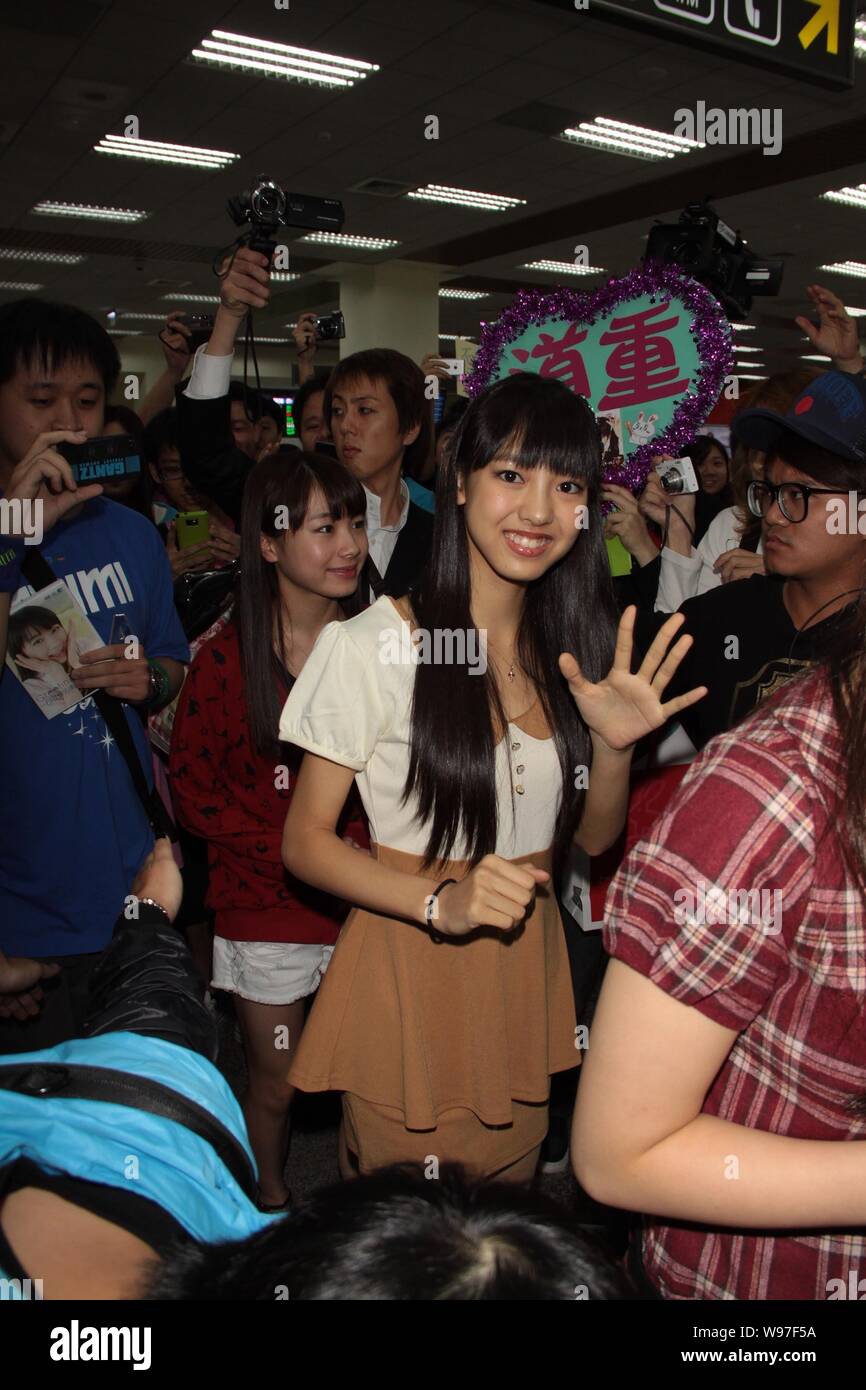 Members of Japanese pop idol girl group Morning Musume arrive at Taipei ...