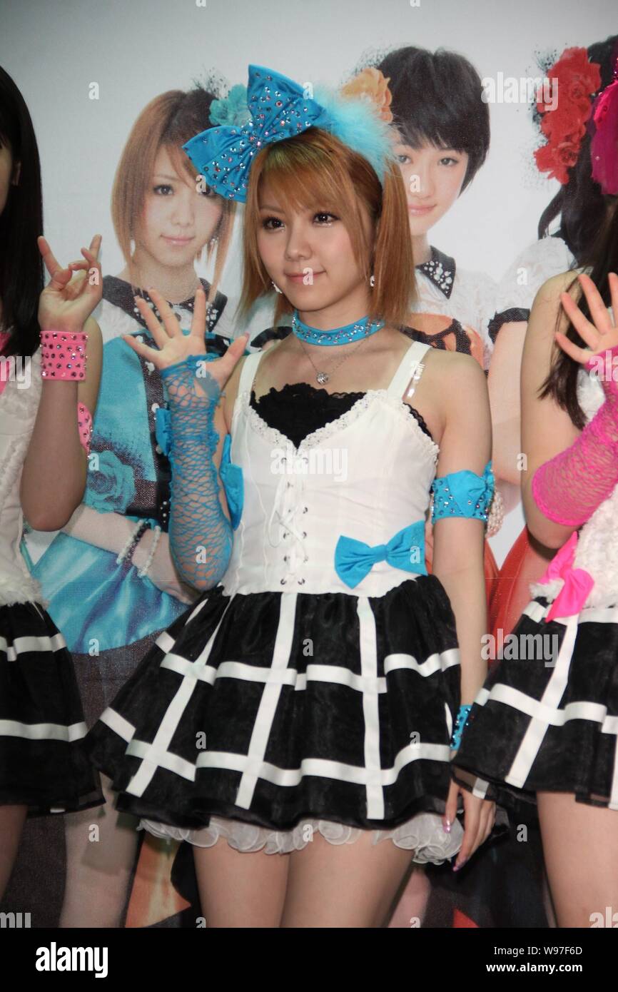Members Of Japanese Pop Idol Girl Group Morning Musume Wave At A Handshake Event To Thank Fans