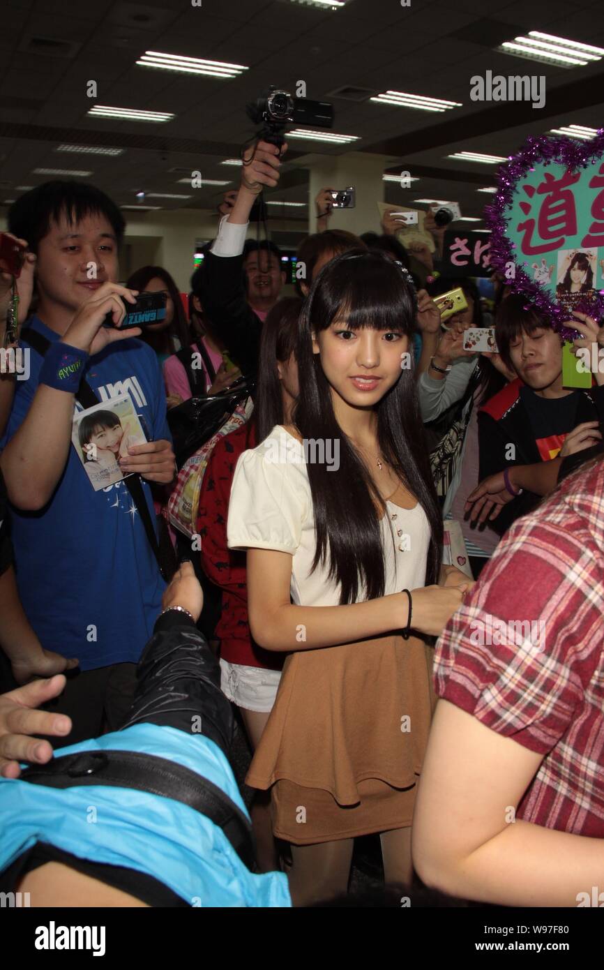 Members of Japanese pop idol girl group Morning Musume arrive at Taipei ...
