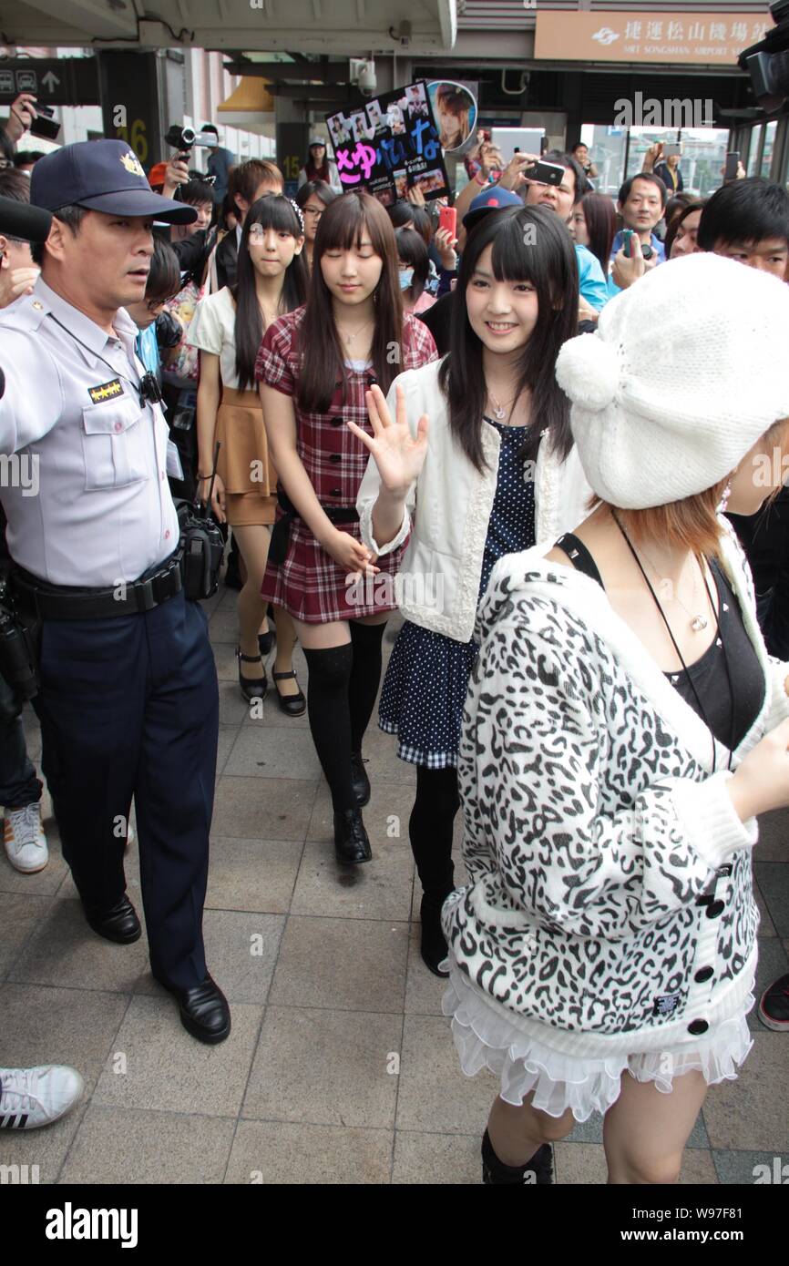 Members of Japanese pop idol girl group Morning Musume arrive at Taipei ...