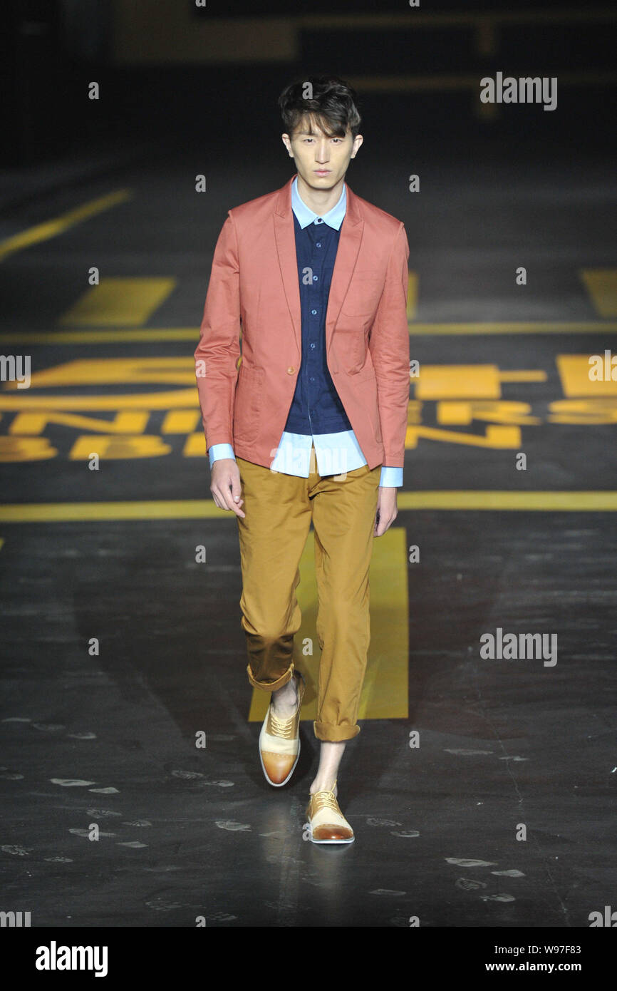 A model displays a new creation in the Cabbeen fashion show during the ...