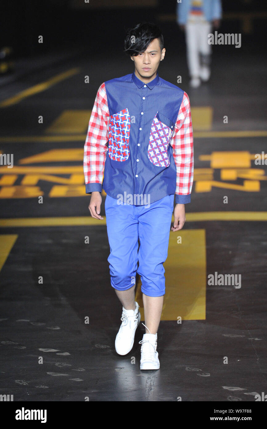 A model displays a new creation in the Cabbeen fashion show during the ...