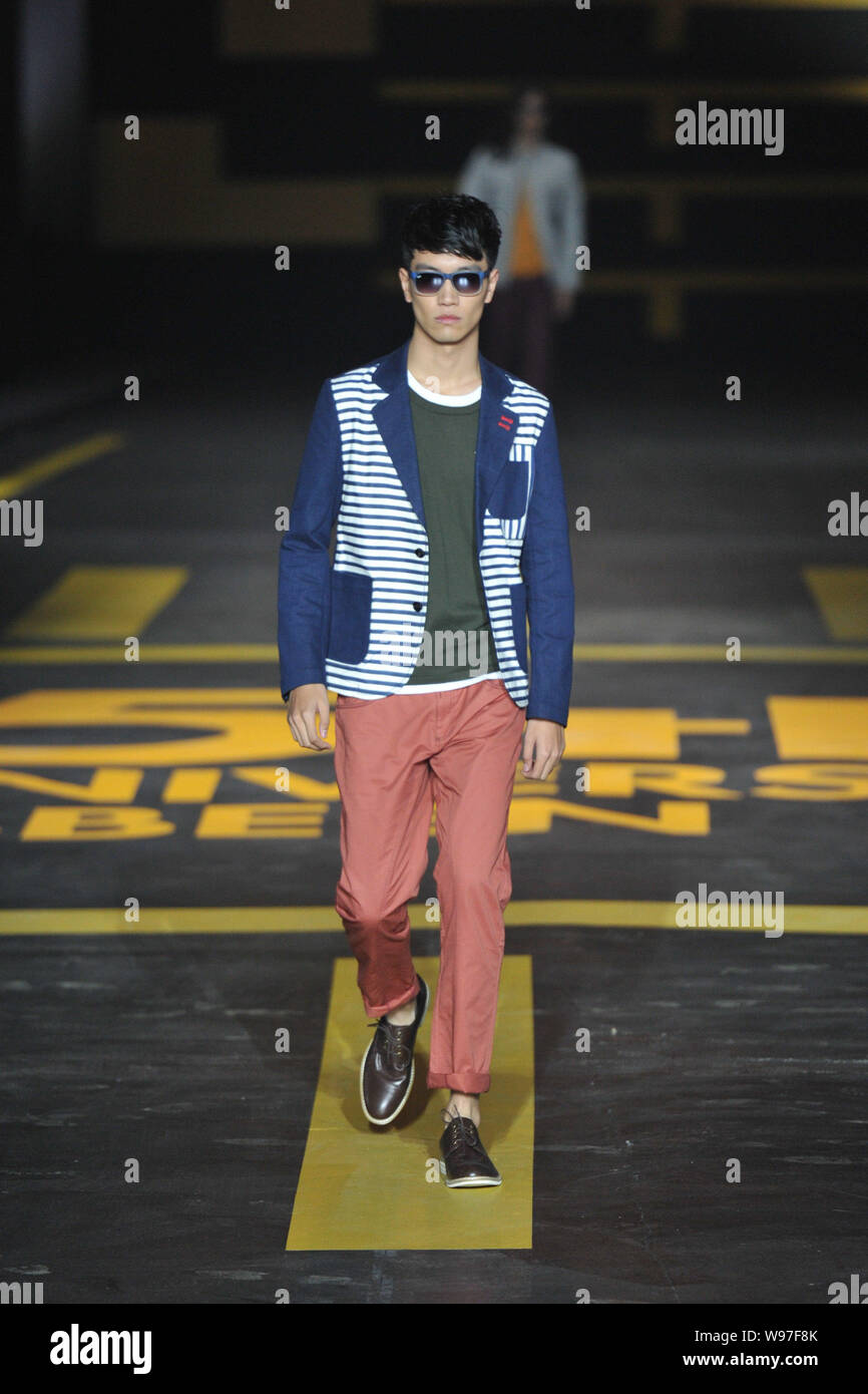A model displays a new creation in the Cabbeen fashion show during the ...
