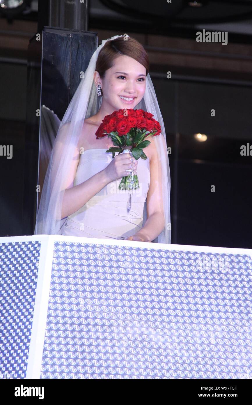Taiwanese singer Rainie Yang Cheng Lin poses at a press conference to ...