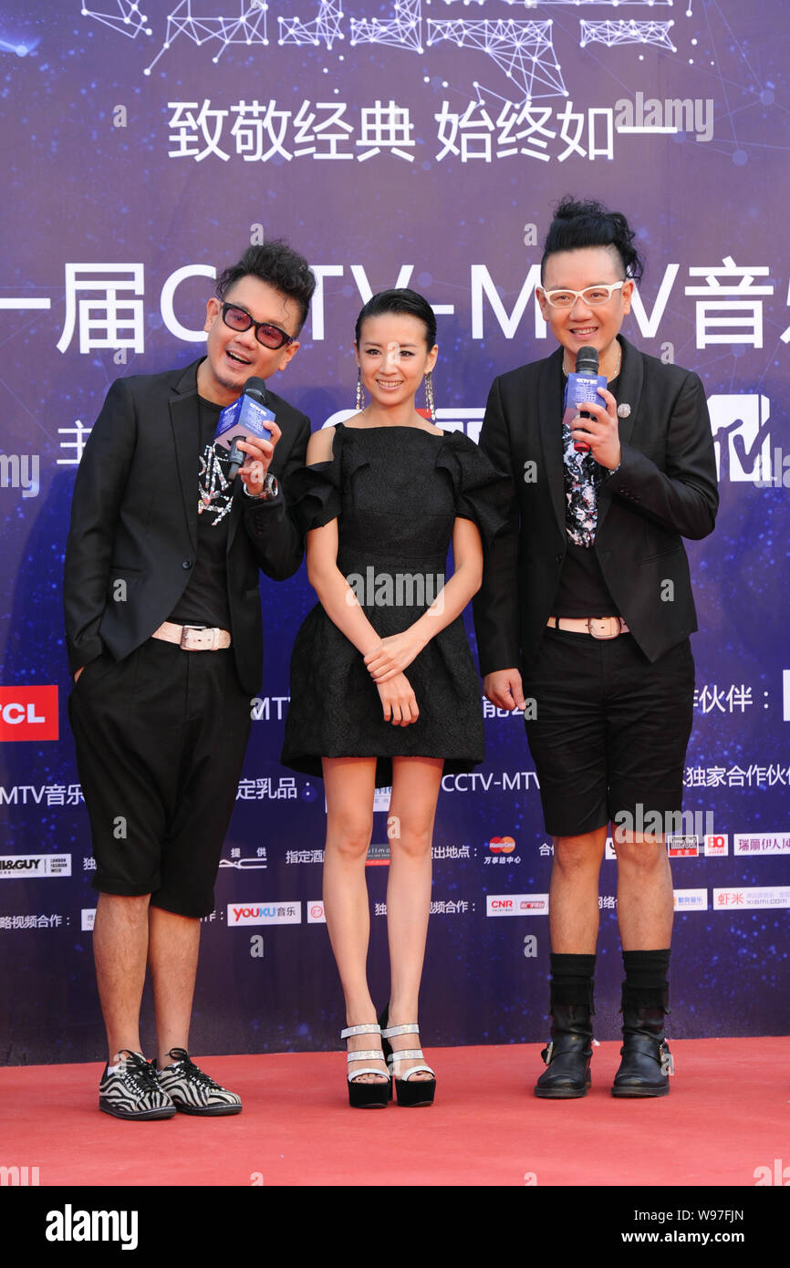 Chinese actress Dong Jie, center, and Singaporean twin music producers ...