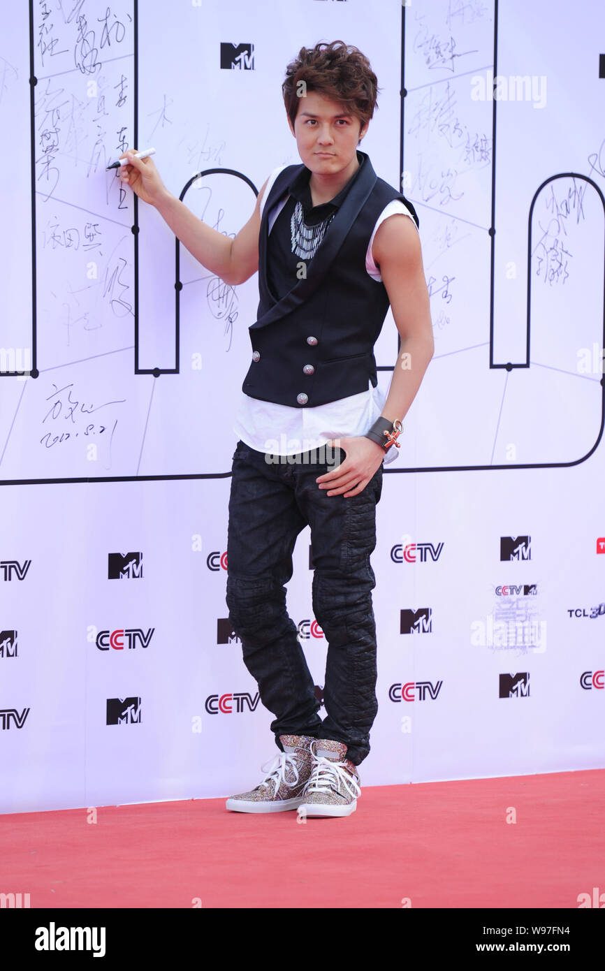 Taiwanese singer Kenji Wu poses on the stage as he arrives for the 11th ...