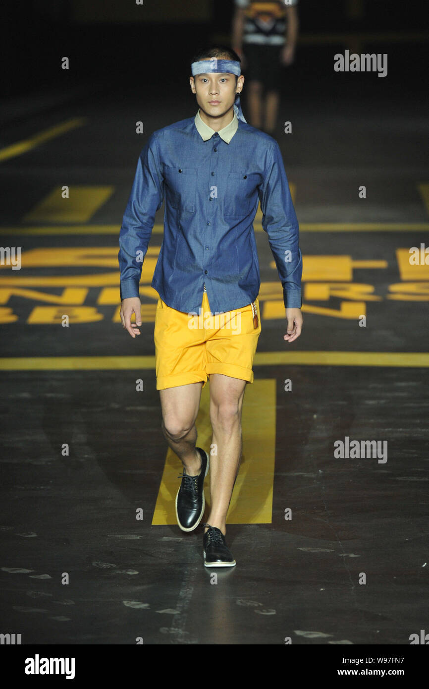 A model displays a new creation in the Cabbeen fashion show during the ...