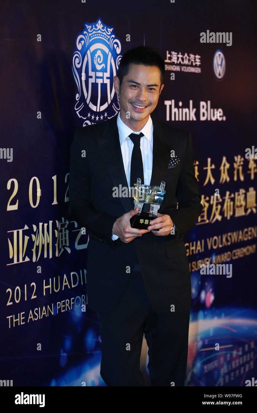 Hong Kong actor Kevin Cheng poses with a trophy the releasing ceremony ...
