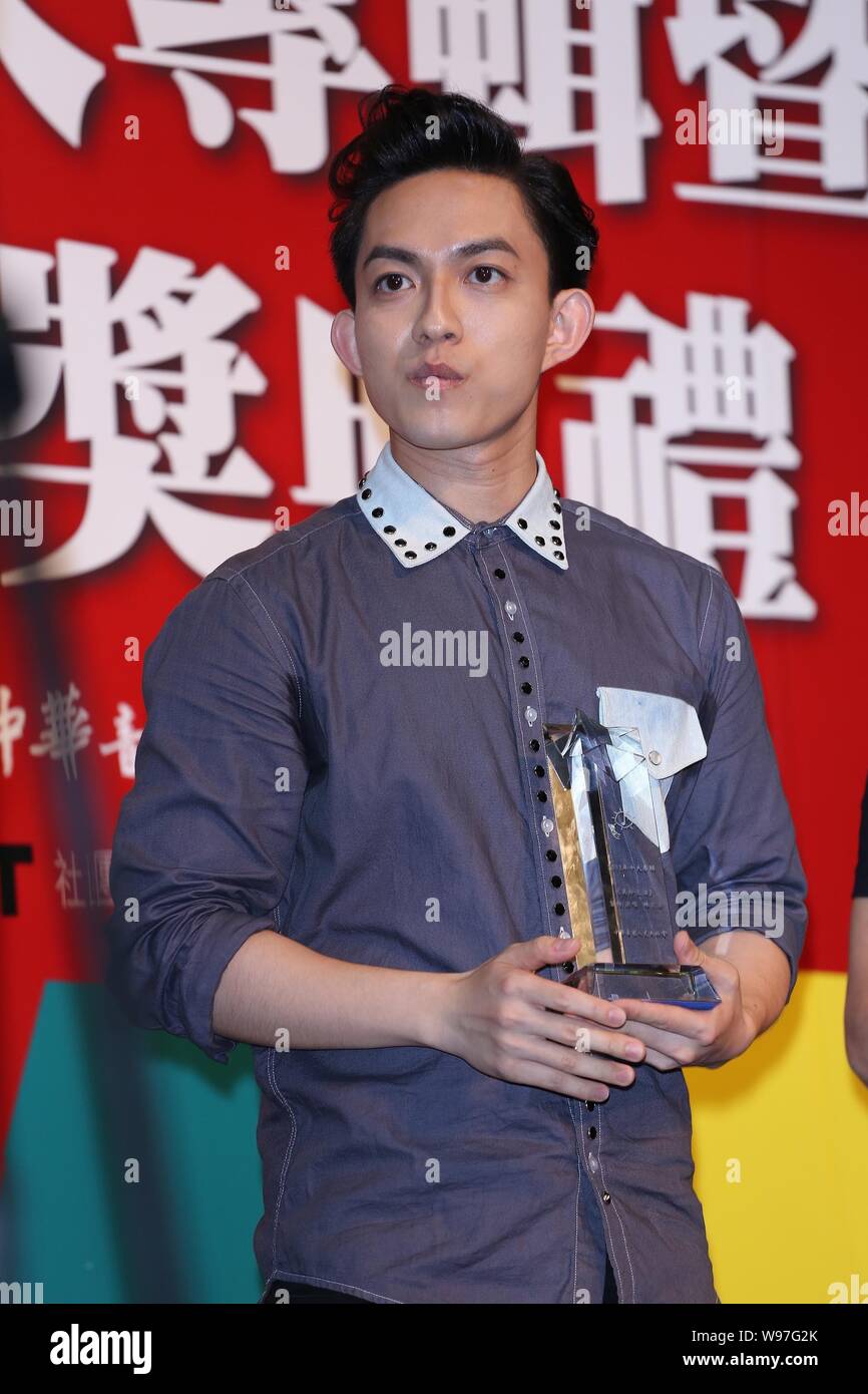 Taiwanese singer Yoga Lin poses with his trophy during music award ...