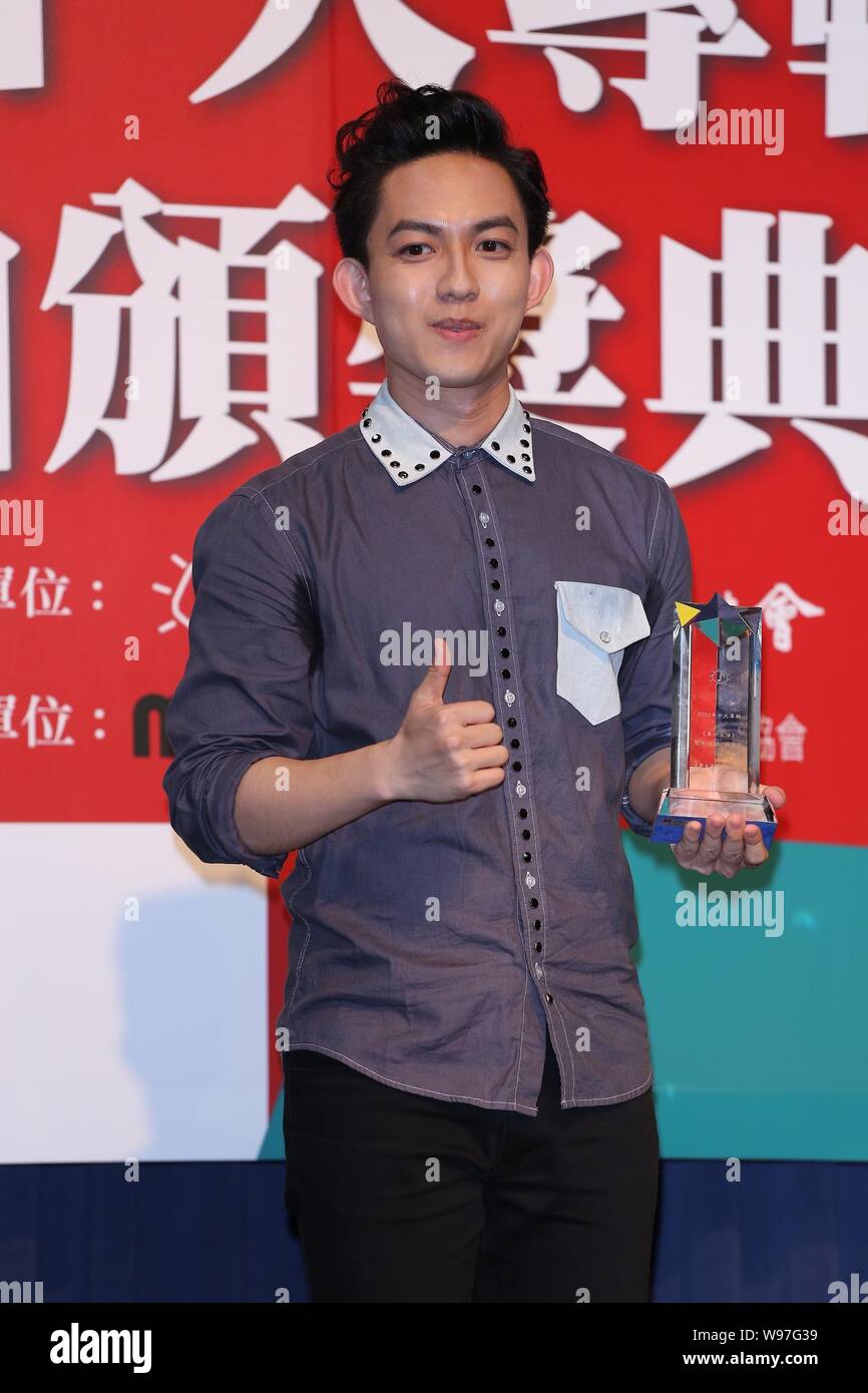 Taiwanese singer Yoga Lin poses with his trophy during a music award ...