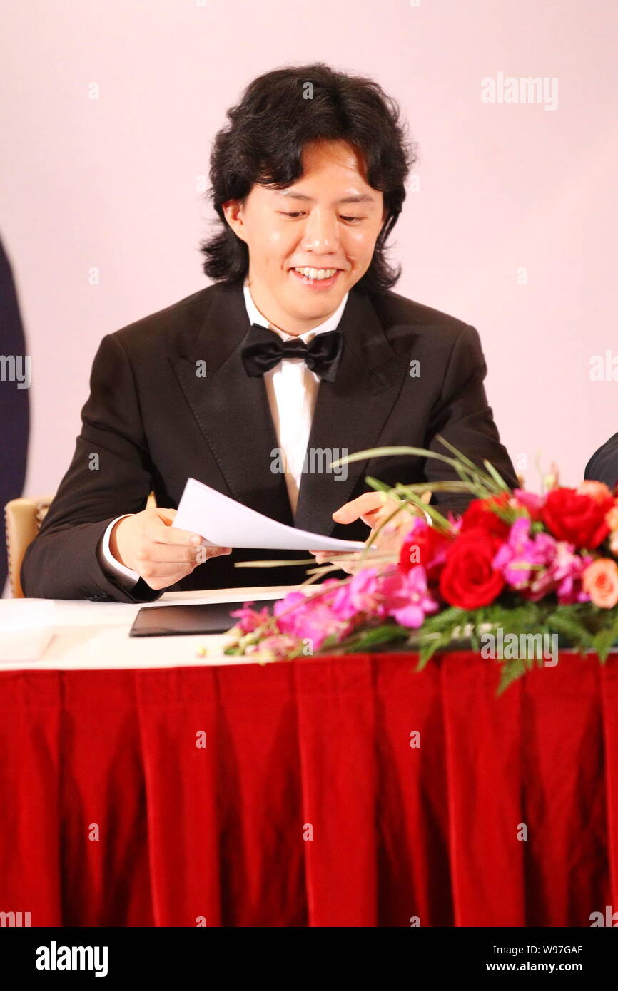 Chinese pianist Li Yundi is pictured during his signing ceremony with ...