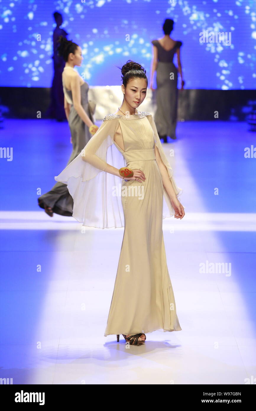 A contestant poses during the 7th China Super Model Final Contest in ...