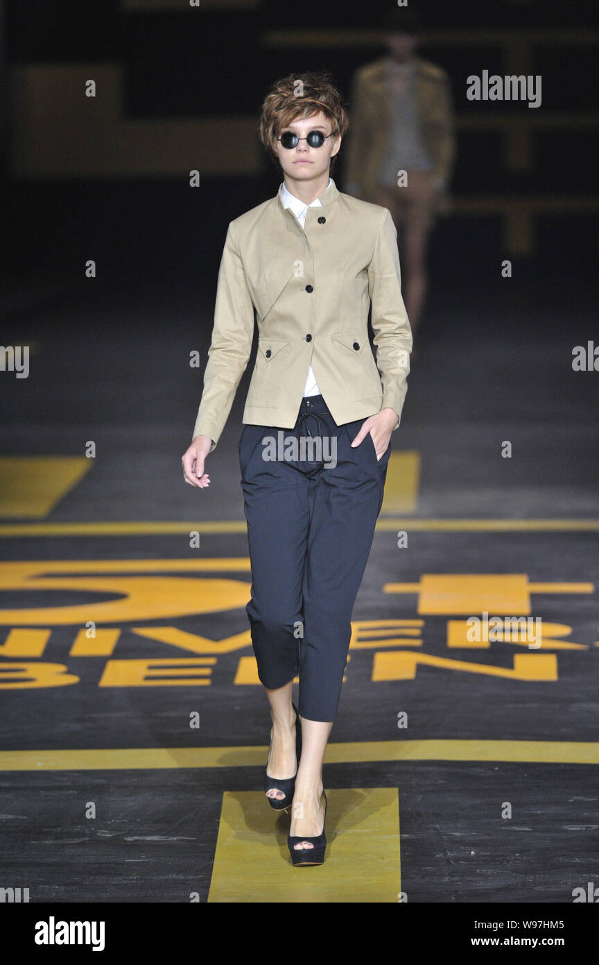 A model displays a new creation in the Cabbeen fashion show during the ...