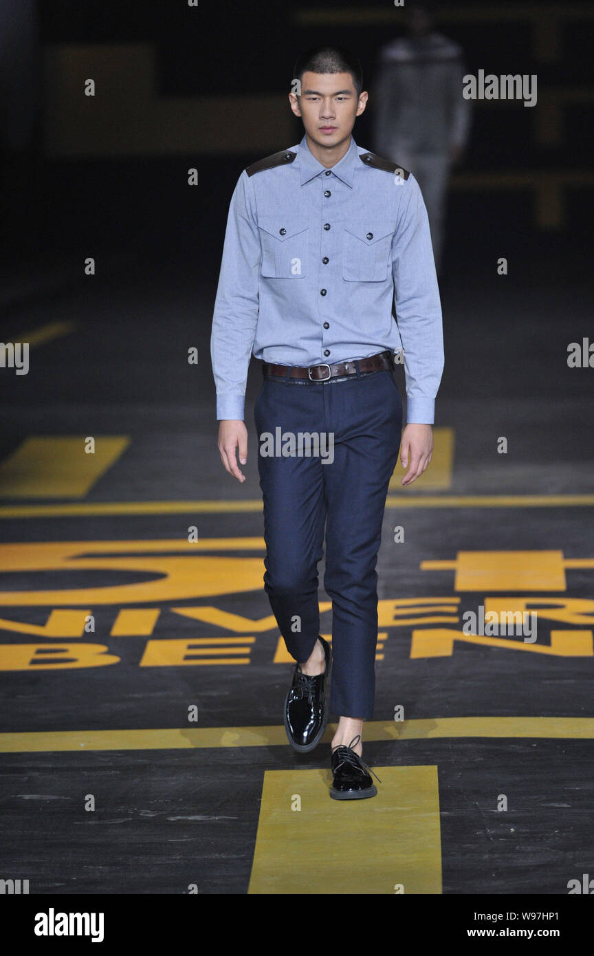 A model displays a new creation in the Cabbeen fashion show during the ...