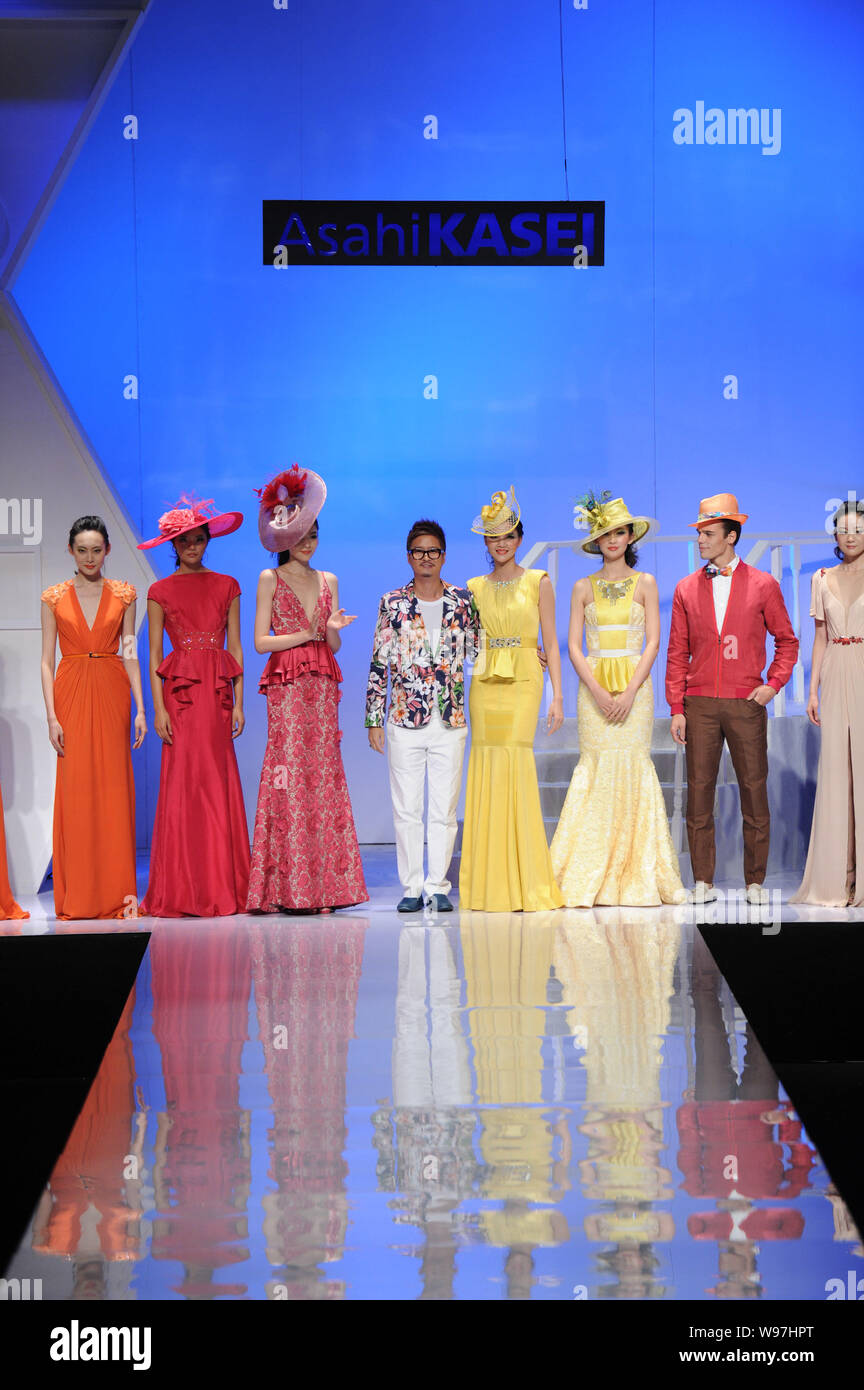 Chinese model Mo Wandan, fourth right, poses with Hong Kong designer ...